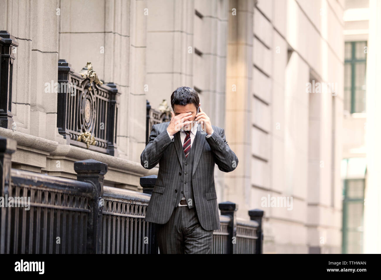 Mature businessman walking outdoors mobile hi-res stock photography and ...