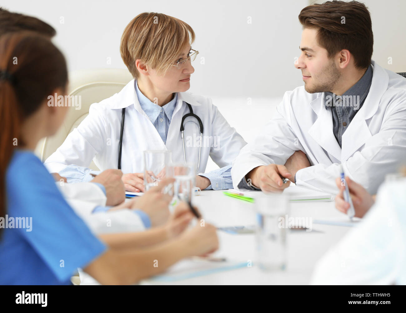 Medical doctors sitting at the meeting in modern hospital Stock Photo ...