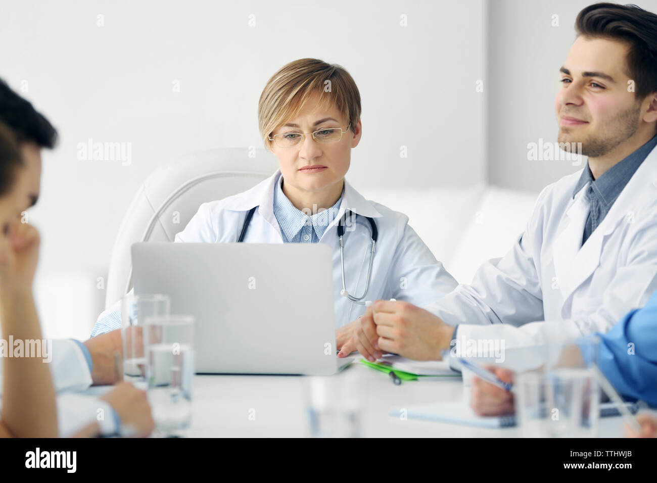 Medical doctors sitting at the meeting in modern hospital Stock Photo ...