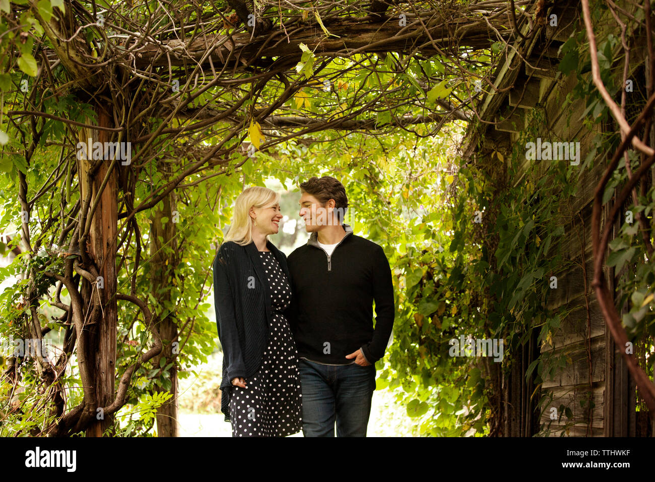 Couple by wall hi-res stock photography and images - Alamy