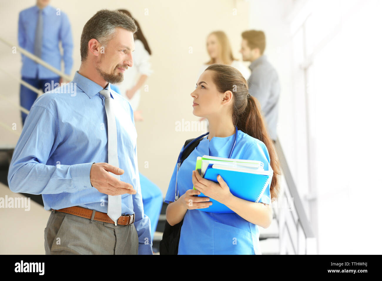 Professor student talking male female hi-res stock photography and ...