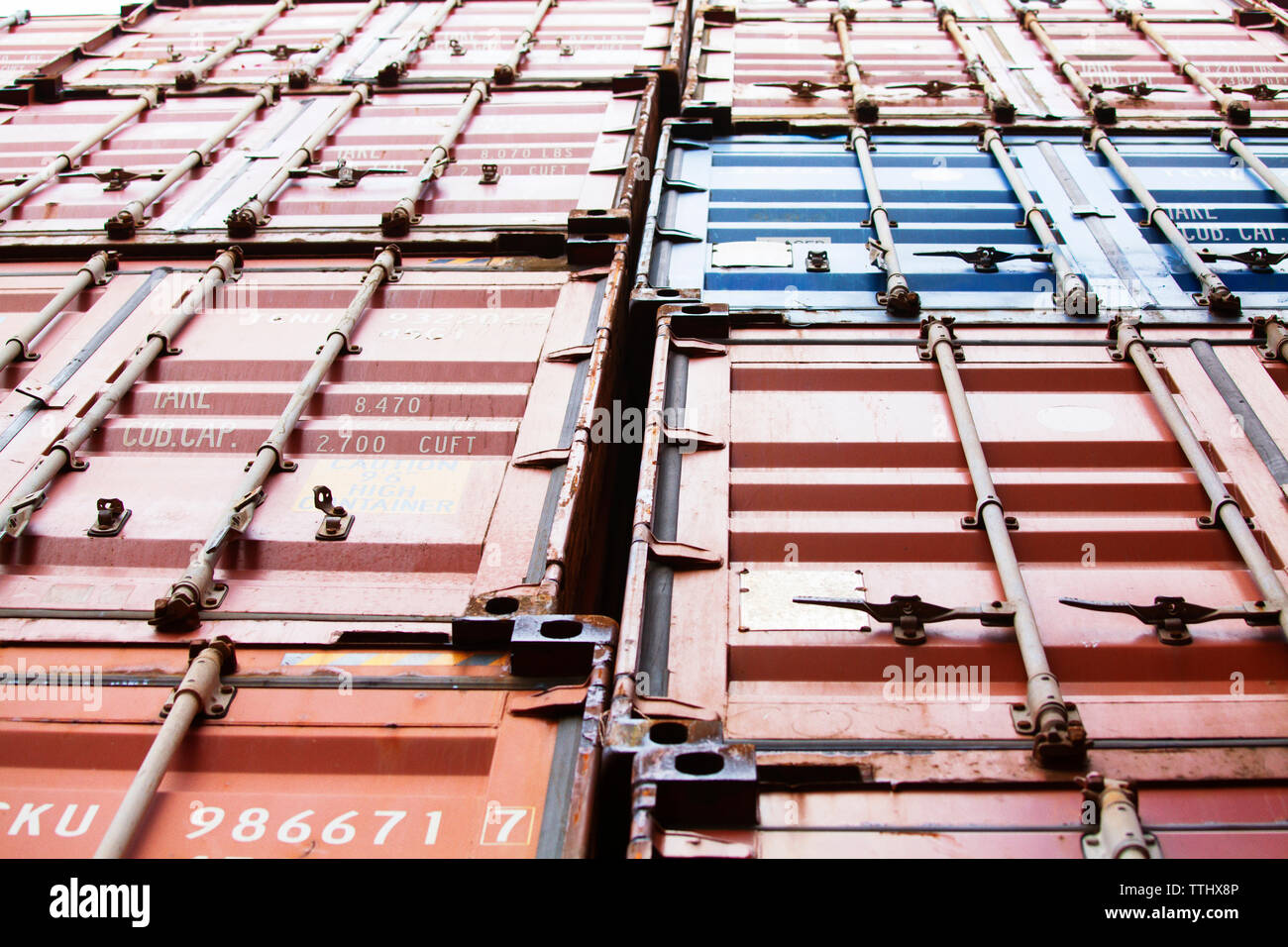 Low angle view of cargo containers at commercial dock Stock Photo - Alamy