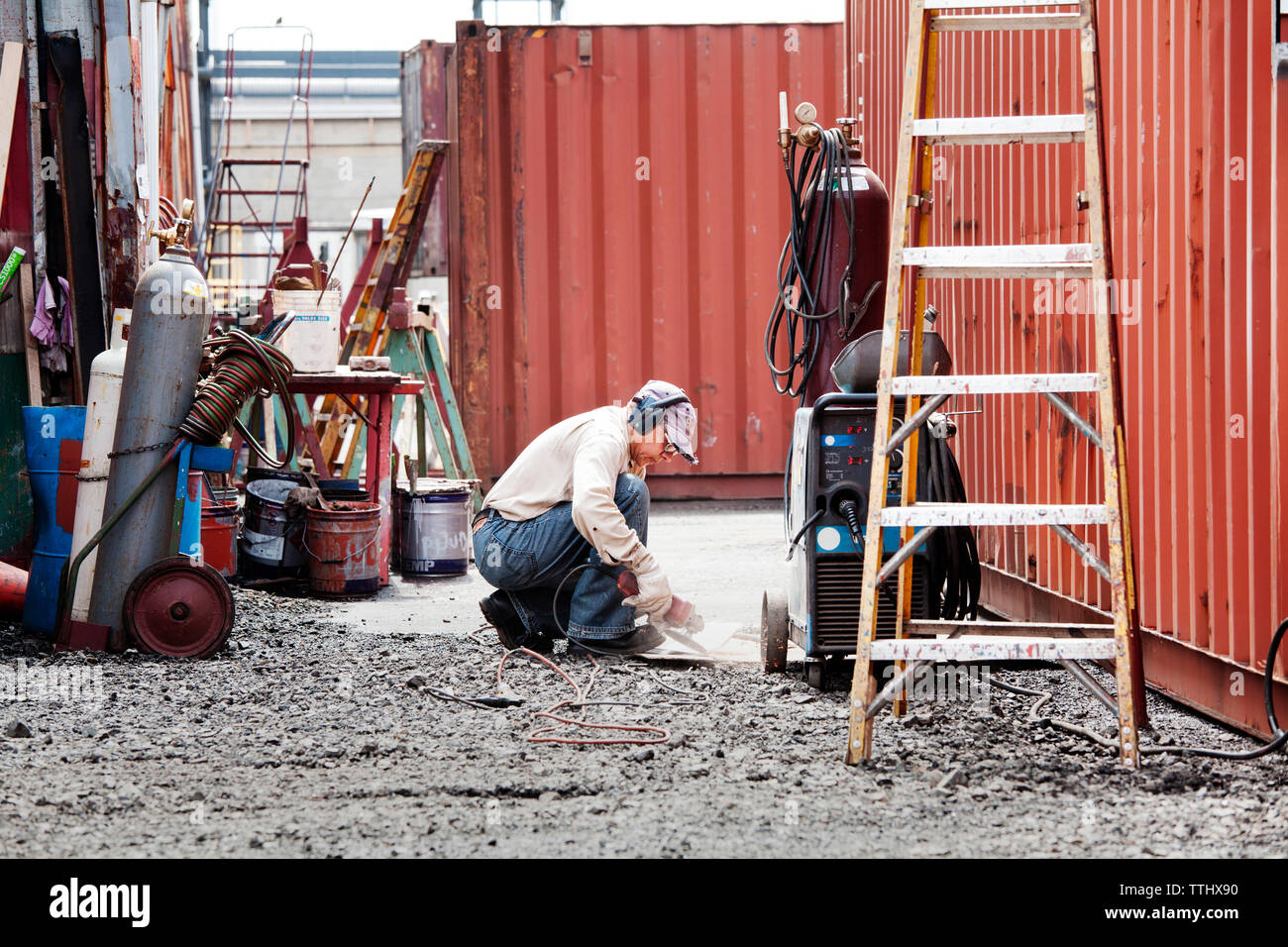 Side view of man working at commercial dock Stock Photo - Alamy