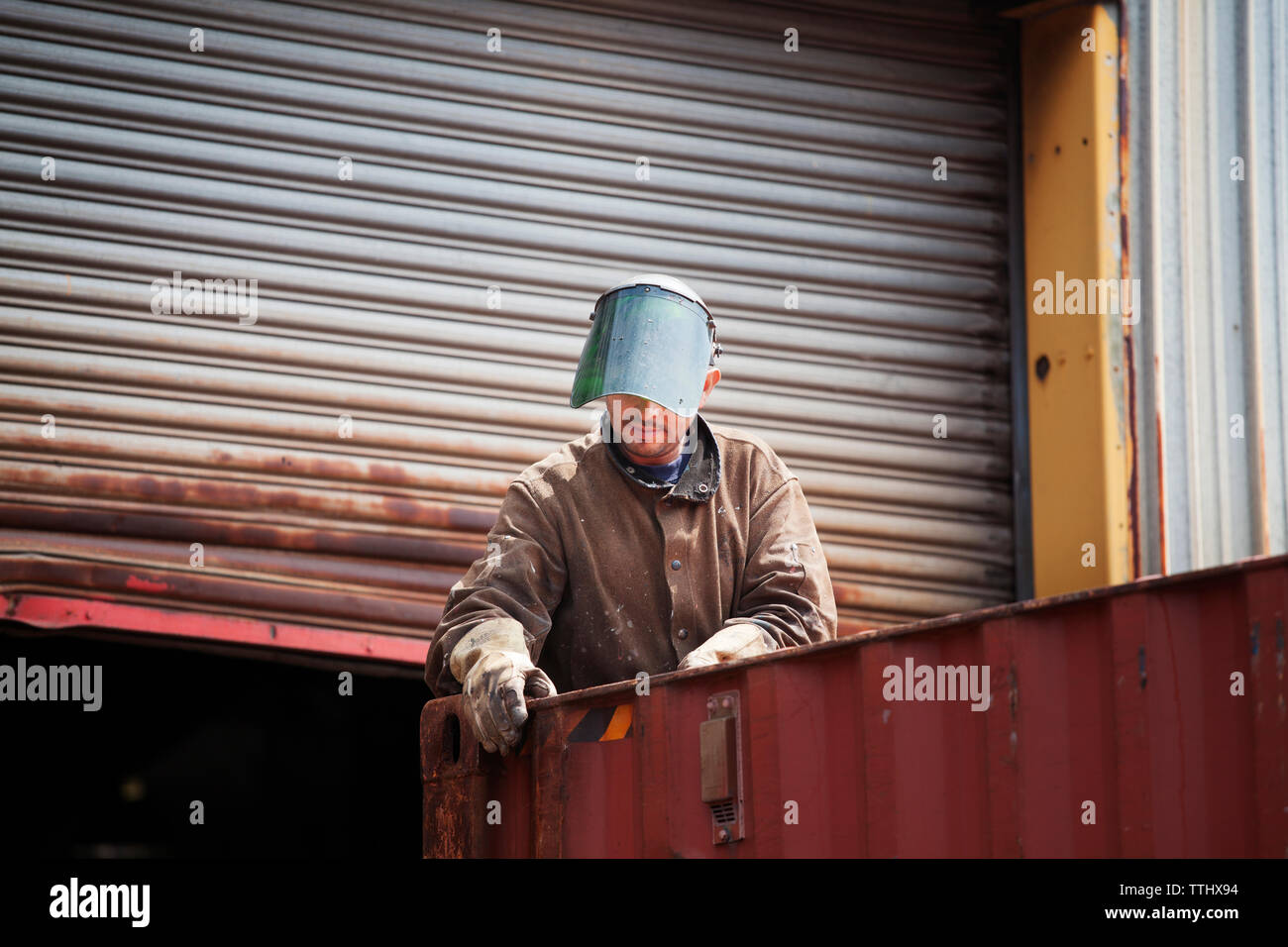 Working manual worker standing holding concentration industry hi-res ...