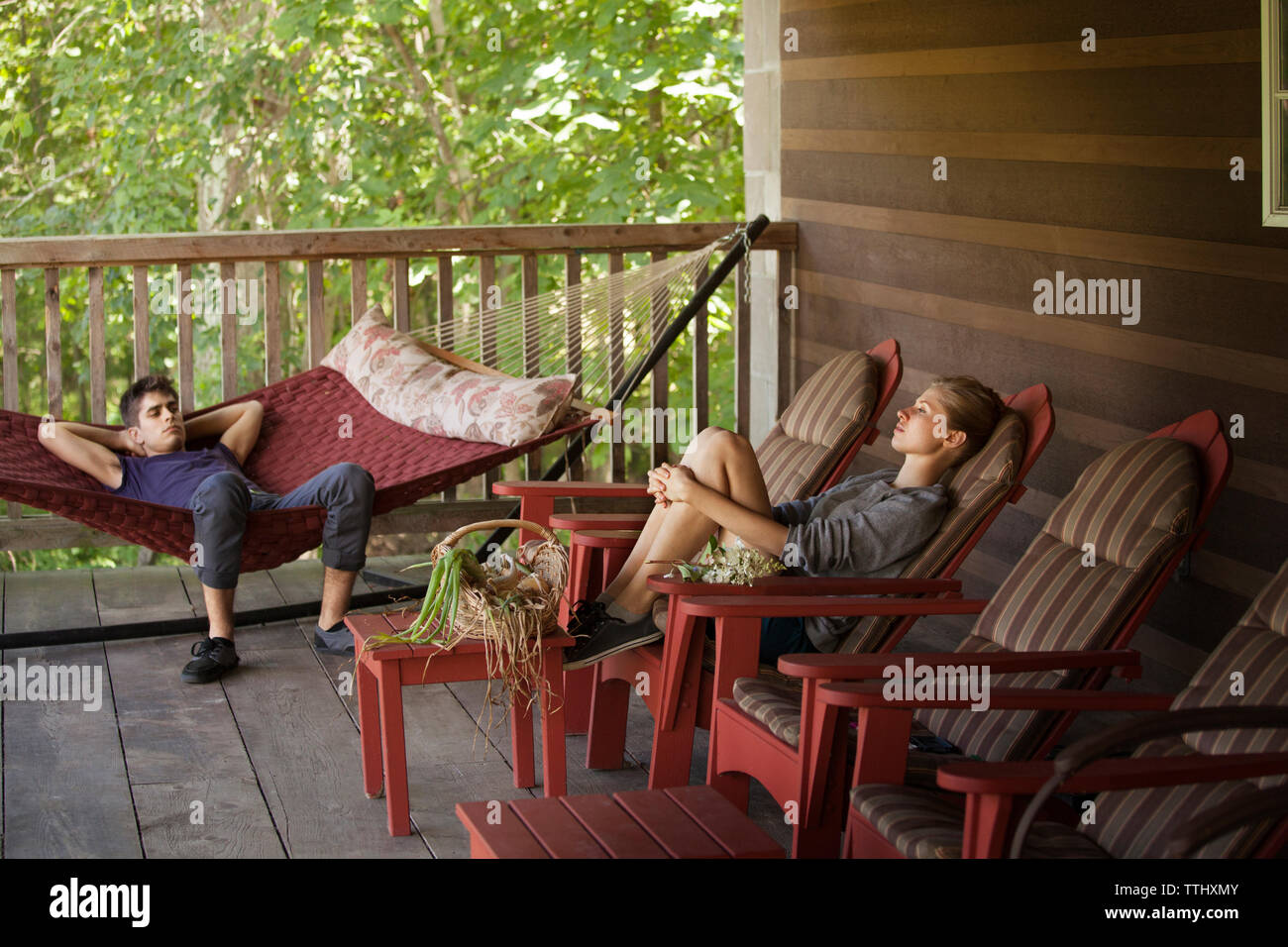 Couple sitting on porch hi-res stock photography and images - Alamy