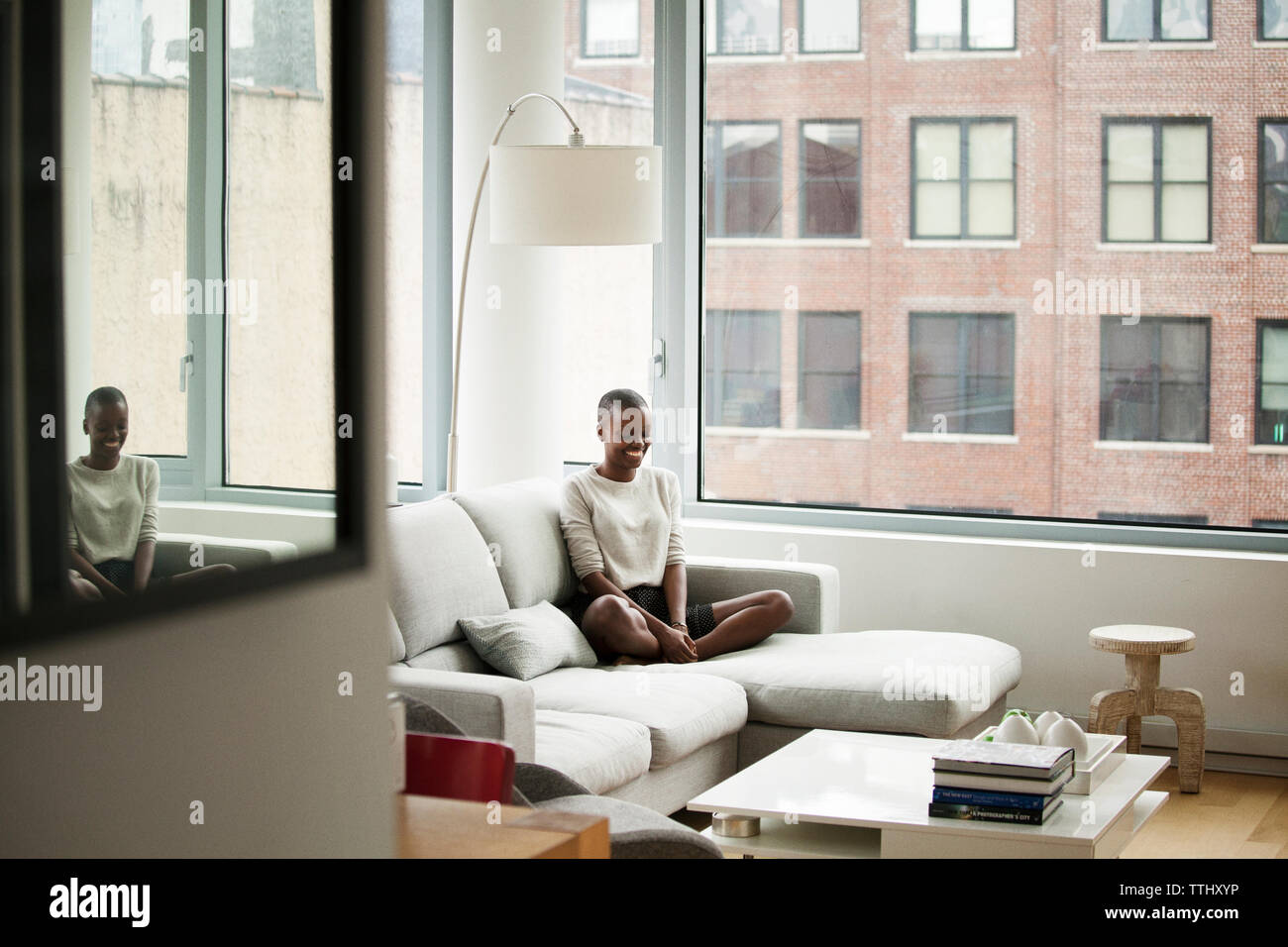 Woman sitting table books hi-res stock photography and images - Alamy