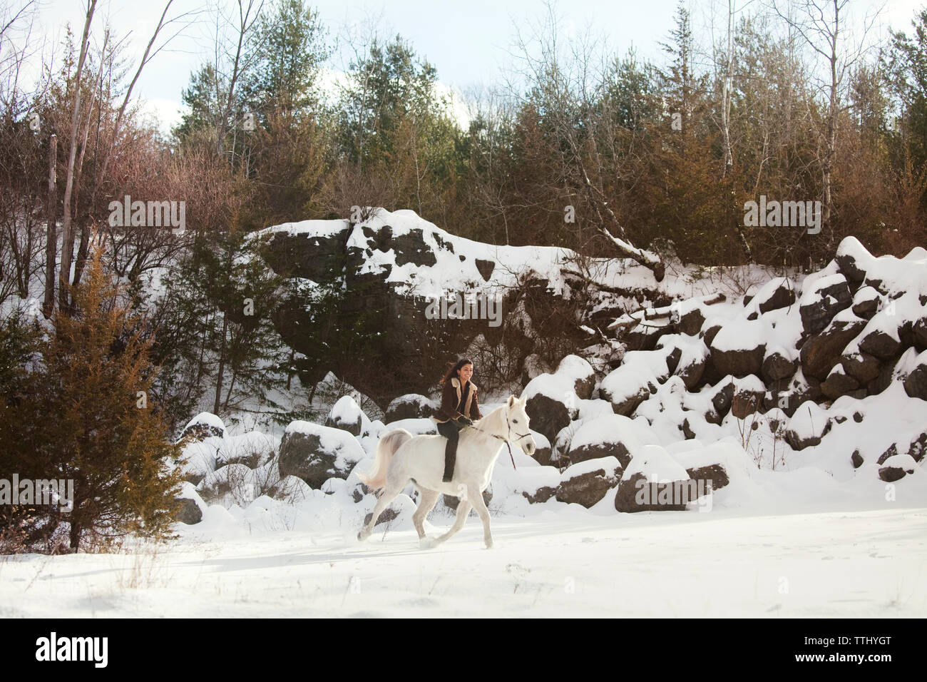 Young woman riding white horse hi-res stock photography and images - Alamy