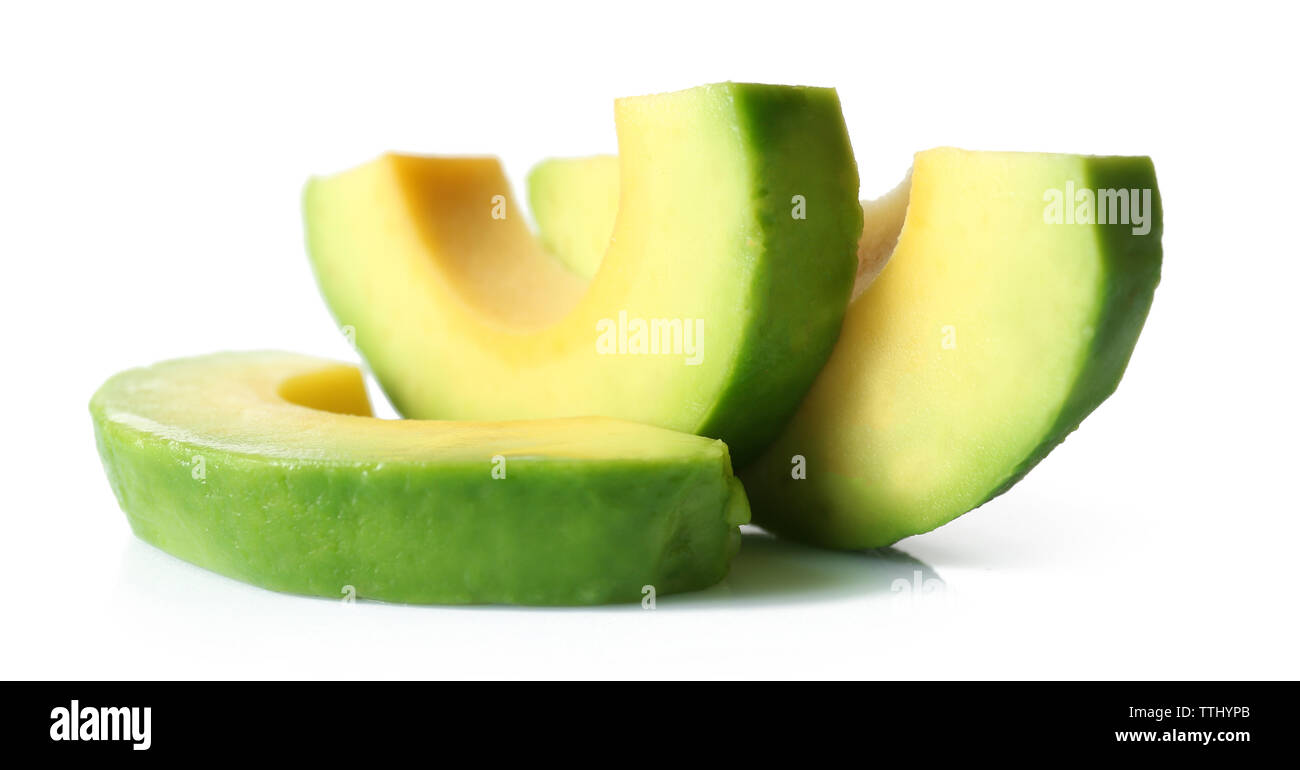 Pieces of avocado isolated on white Stock Photo - Alamy