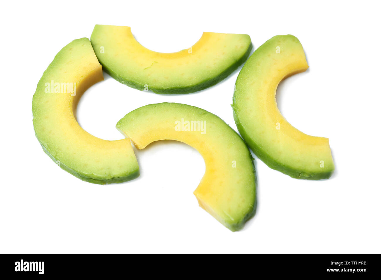 Pieces of avocado isolated on white Stock Photo - Alamy