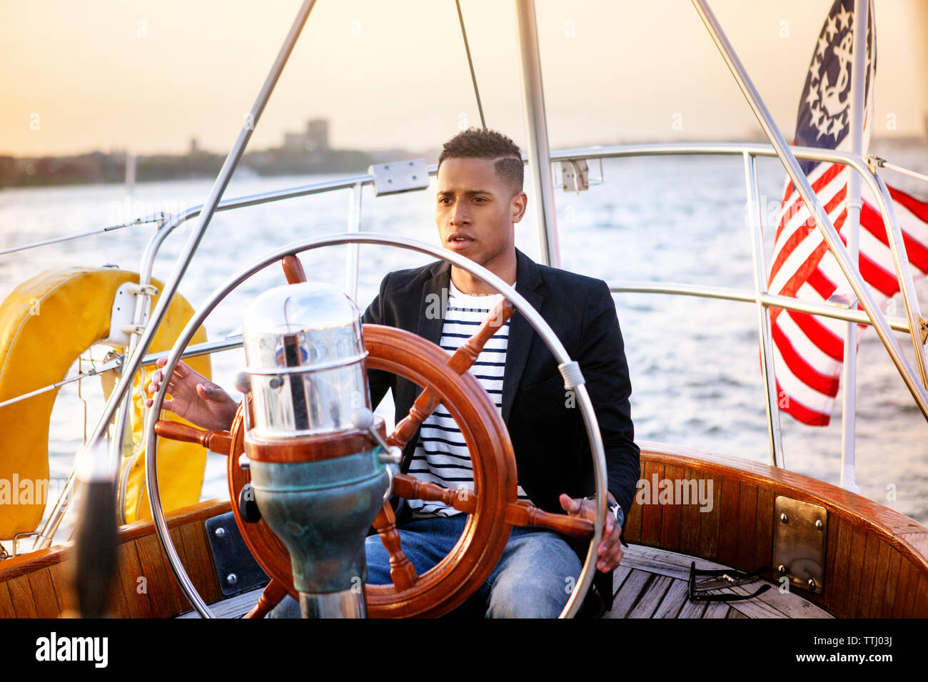 Man sailing yacht Stock Photo - Alamy