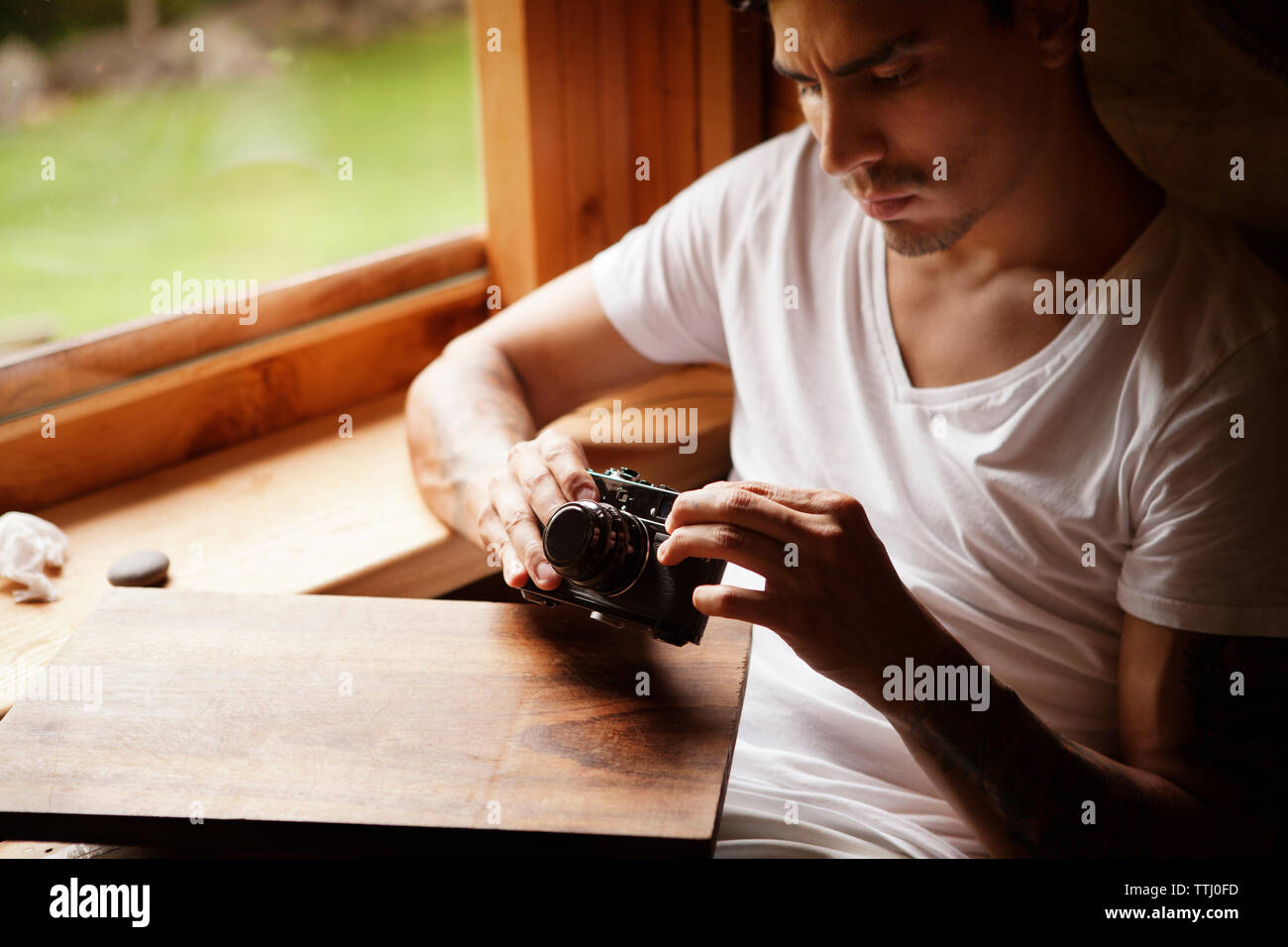 Sitting holding concentration looking down hi-res stock photography and ...
