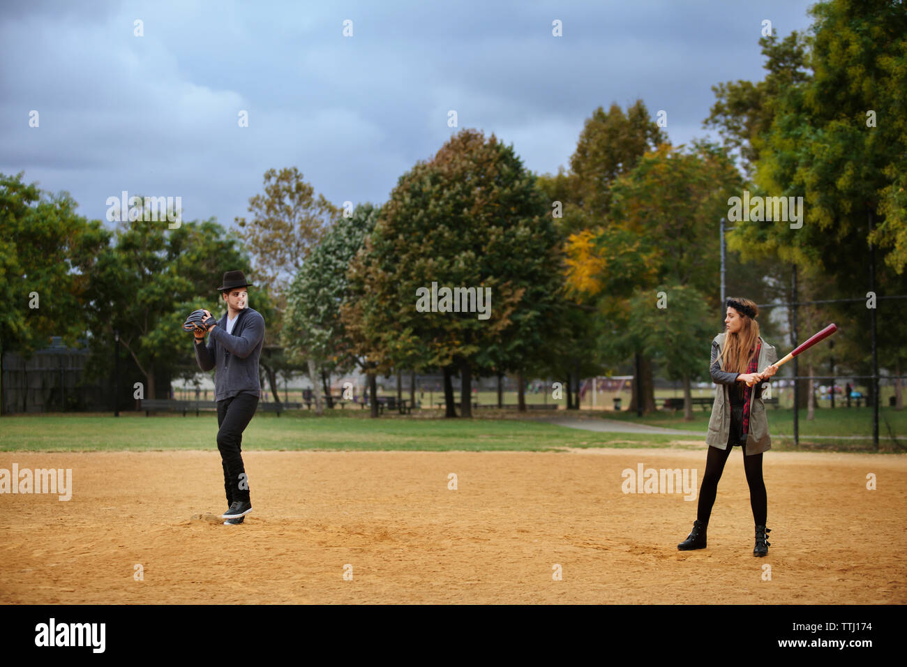 Happy young woman baseball bat hi-res stock photography and images - Alamy