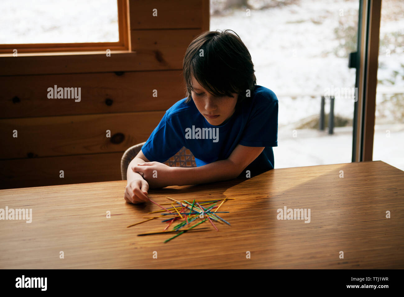 Boy playing with sticks hi-res stock photography and images - Alamy