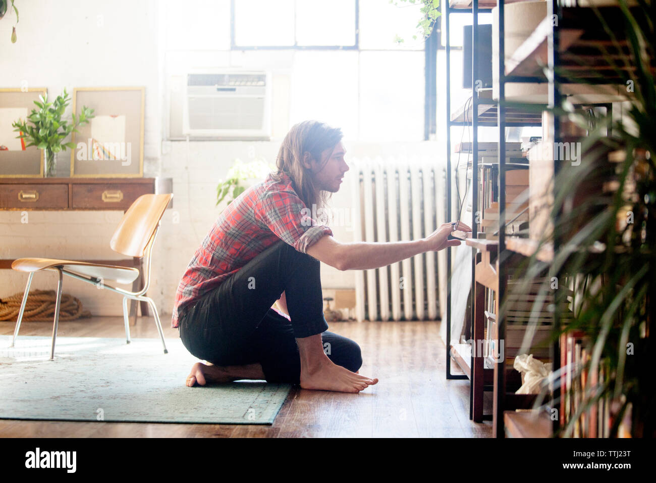 Person looking at books hi-res stock photography and images - Alamy