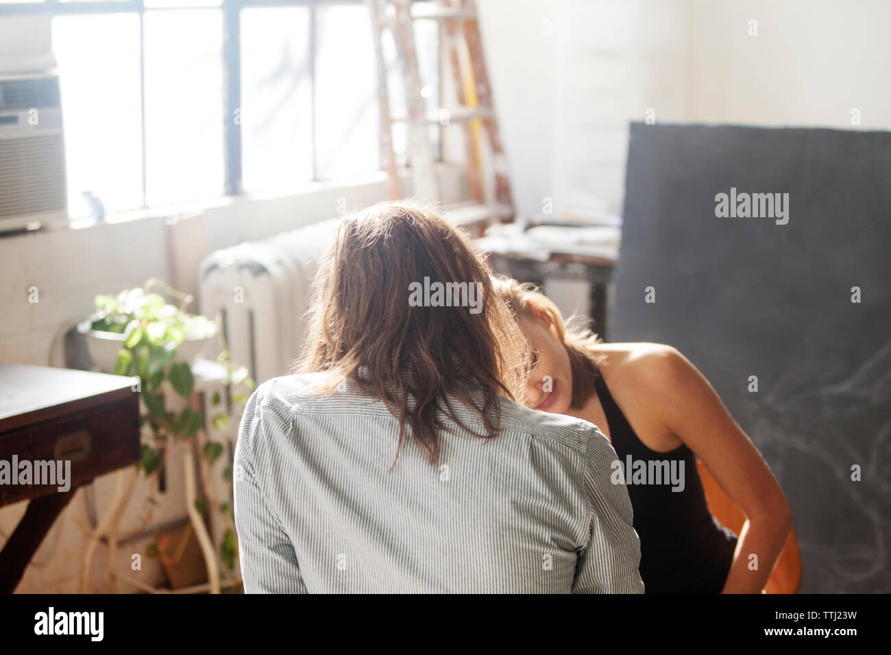 Young woman old man rear view hi-res stock photography and images - Alamy