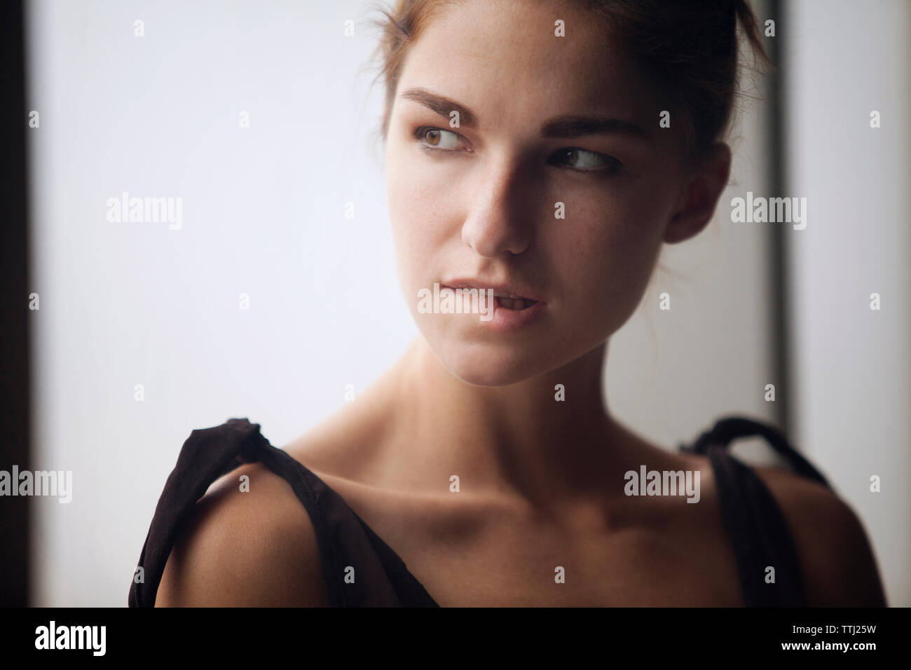 Biting lip hi-res stock photography and images - Alamy