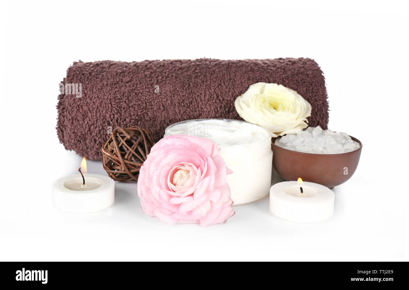 Spa treatment with towel and cream isolated on white Stock Photo - Alamy