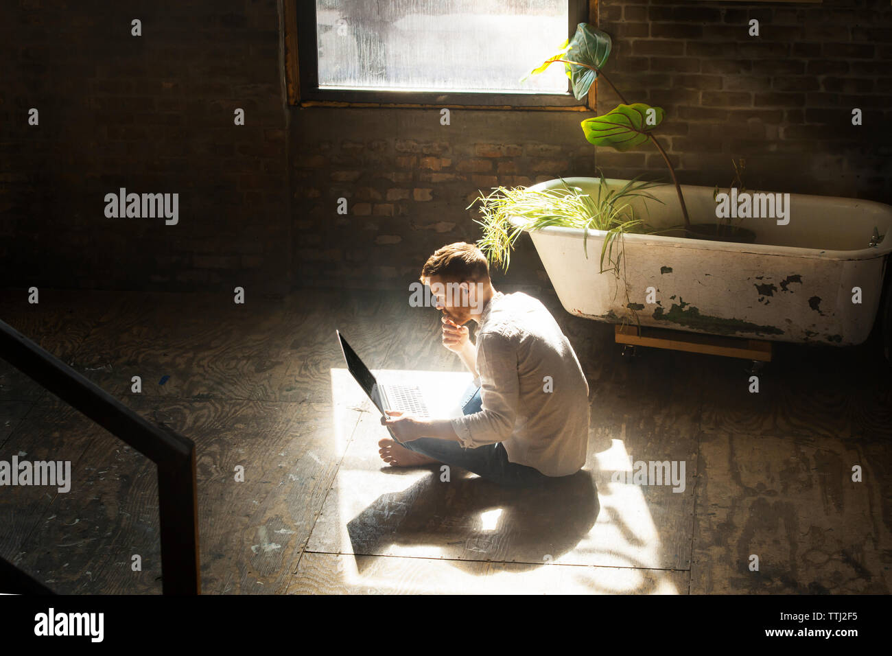 Man computer sitting rear view hi-res stock photography and images - Alamy