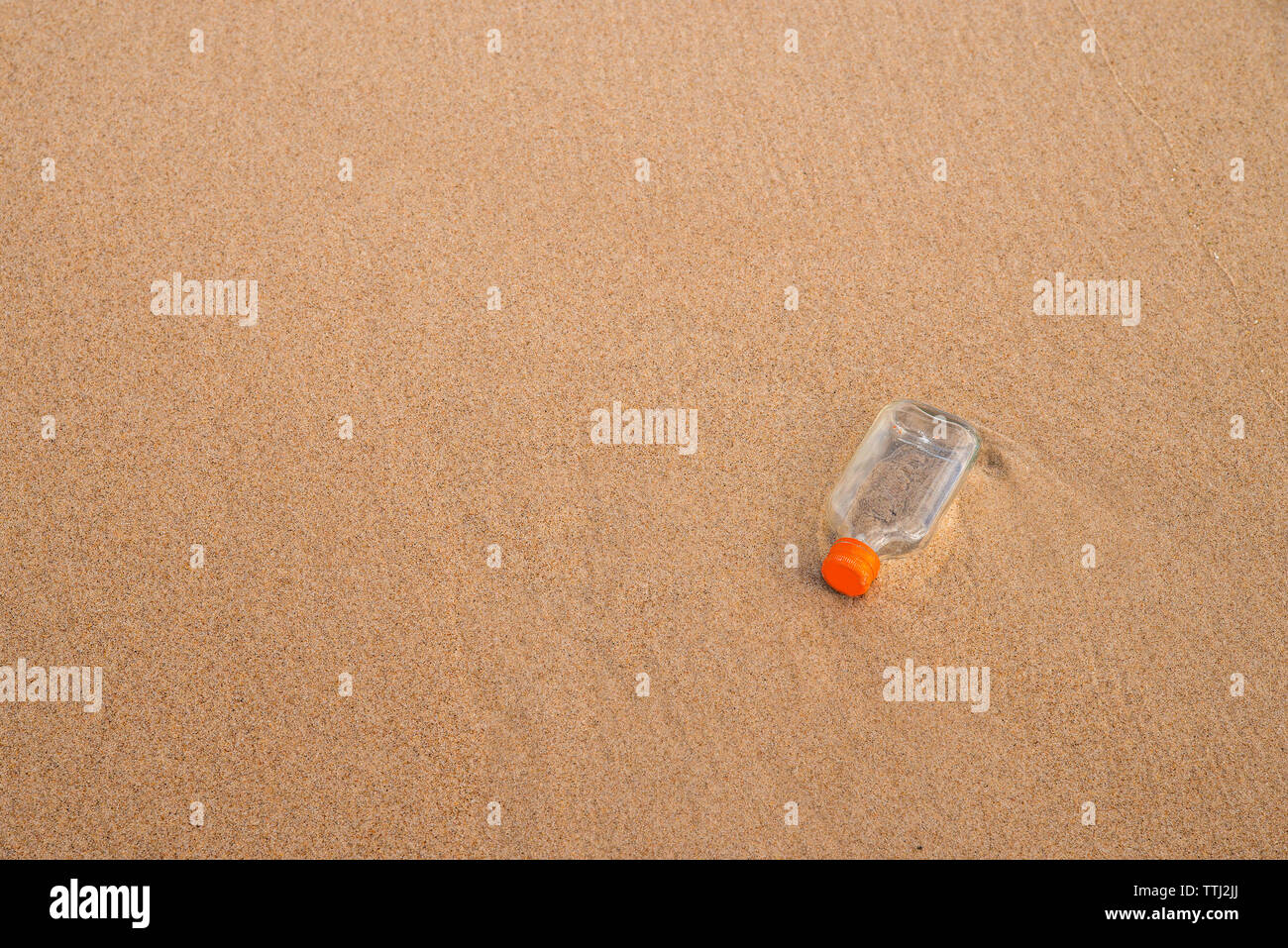 liquor bottle on a beach Stock Photo - Alamy