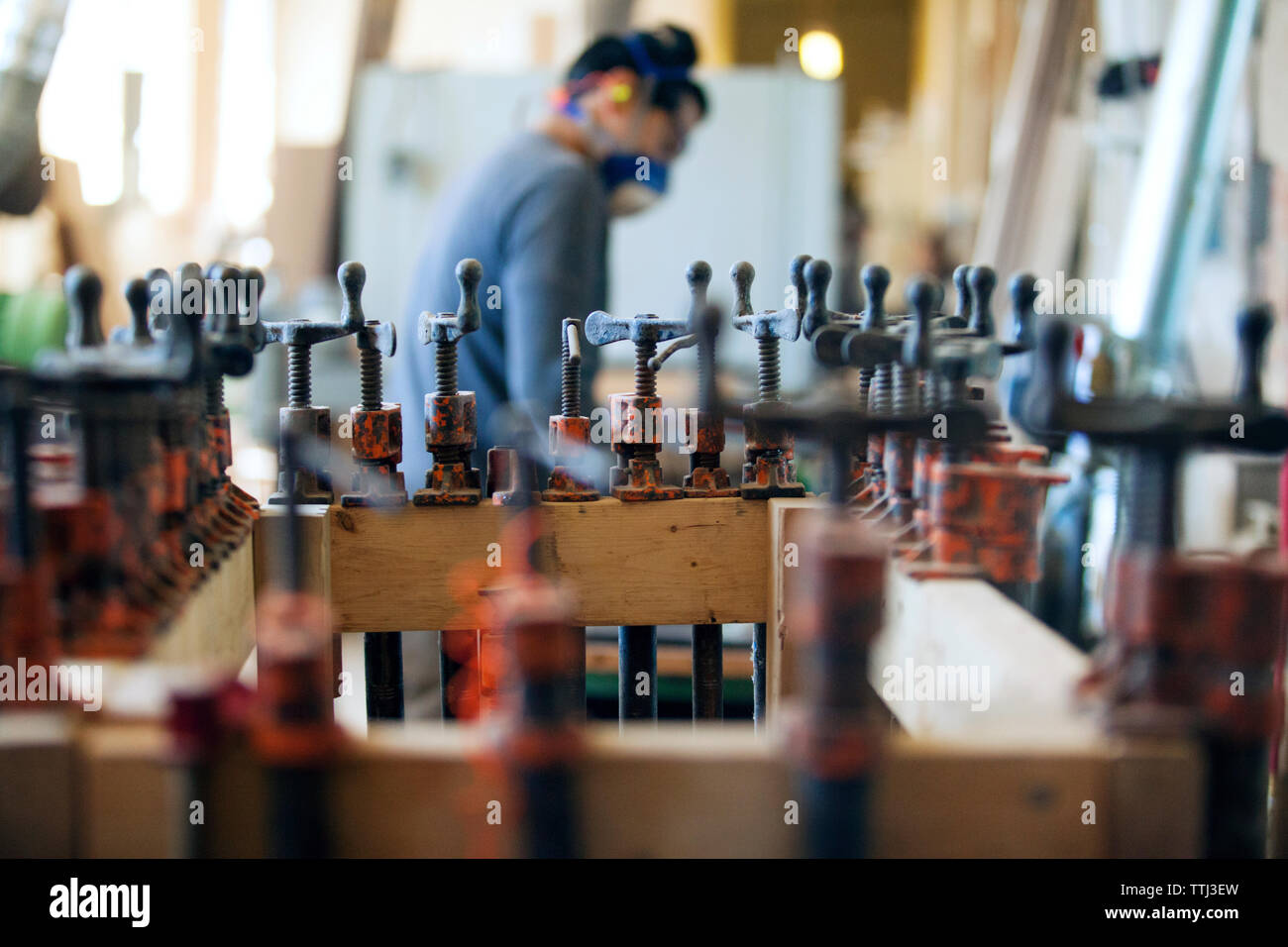 Side view of male carpenter in workshop Stock Photo - Alamy