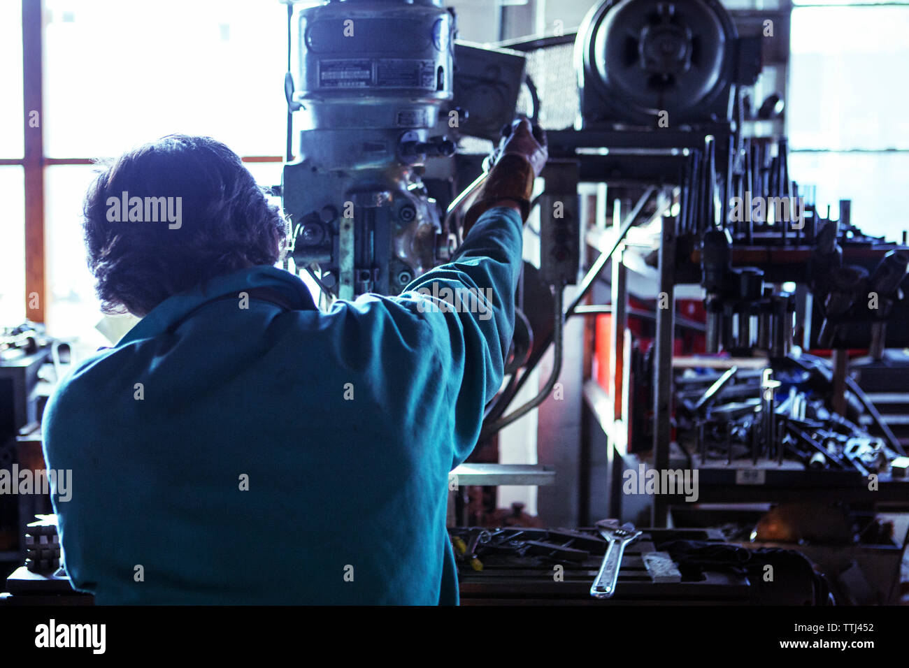 Person operating machine hi-res stock photography and images - Alamy