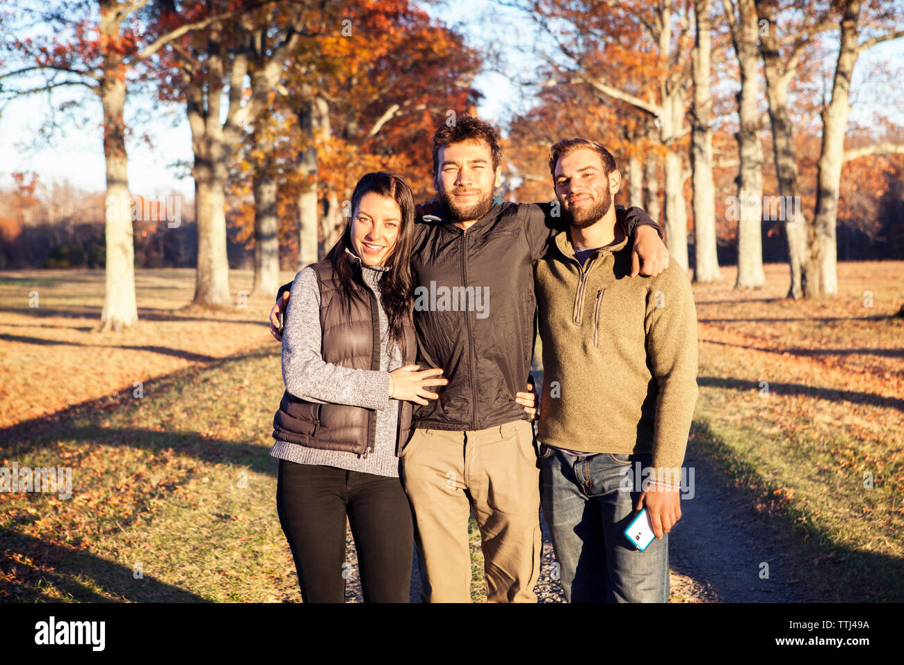 Friends standing side by side hi-res stock photography and images - Alamy