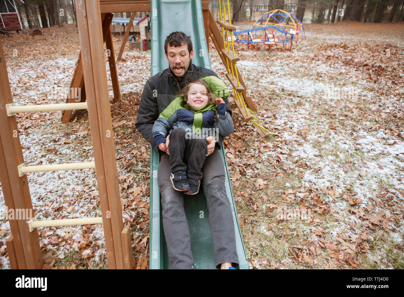Boy sliding on slide park hi-res stock photography and images - Alamy