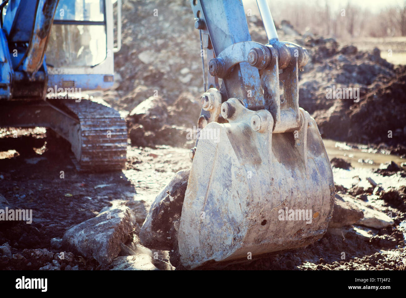 Earth mover digging land at construction site Stock Photo - Alamy