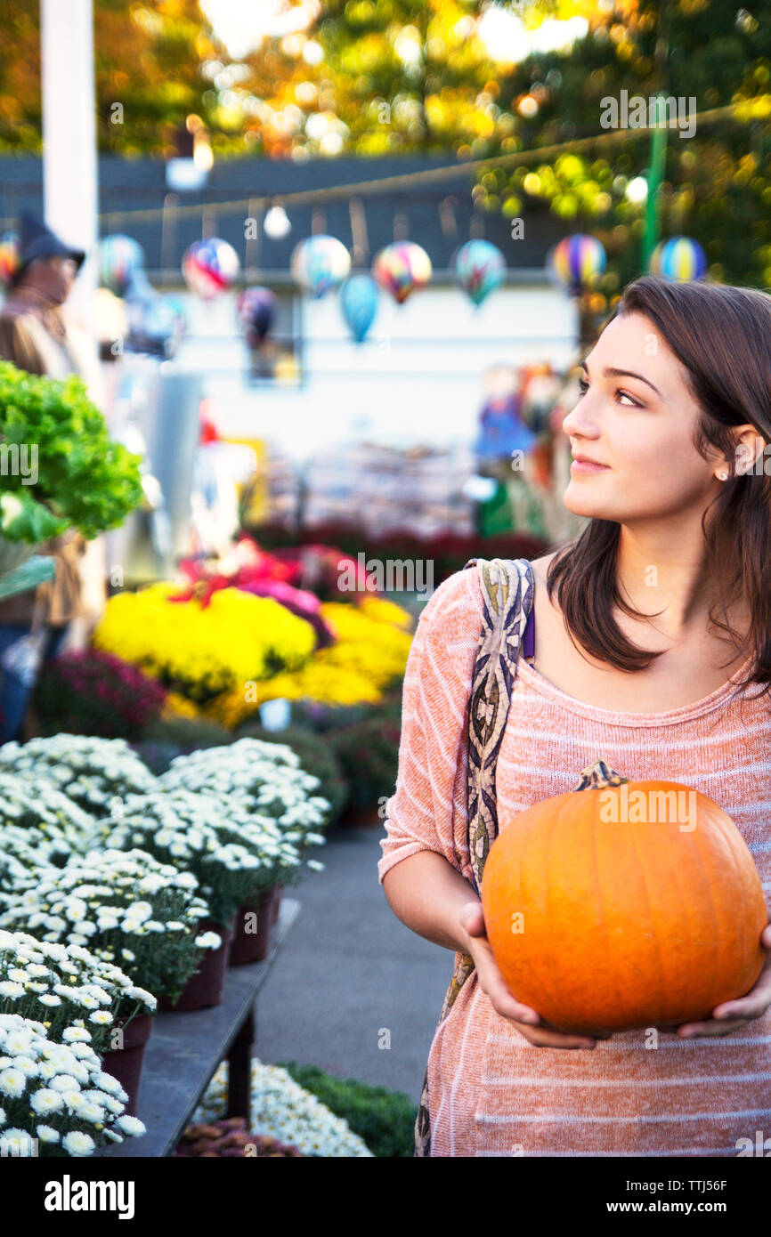 Woman carrying pumpkins hi-res stock photography and images - Alamy