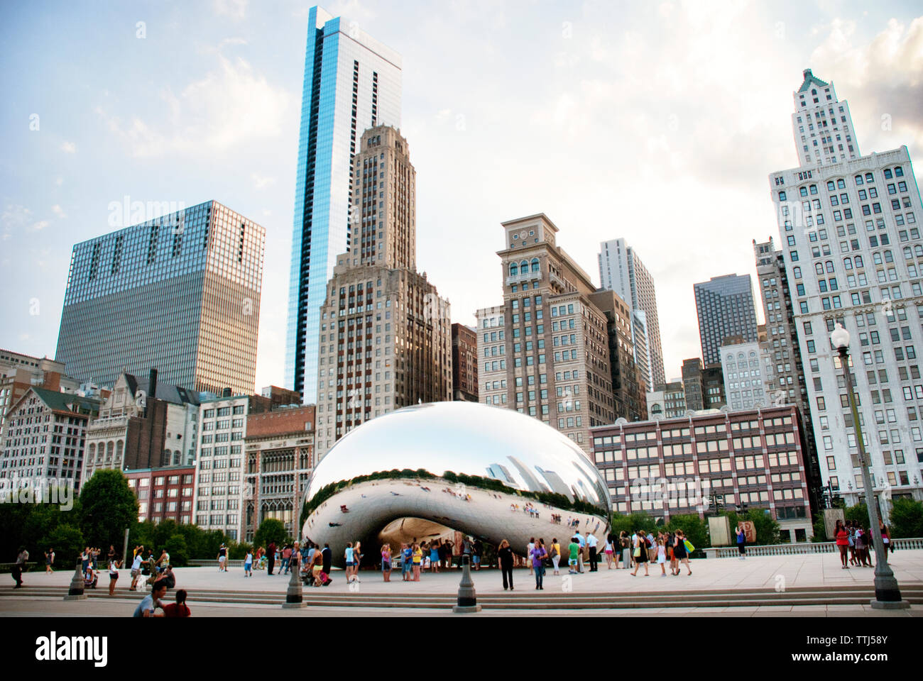 Cloud Gate against buildings Stock Photo - Alamy