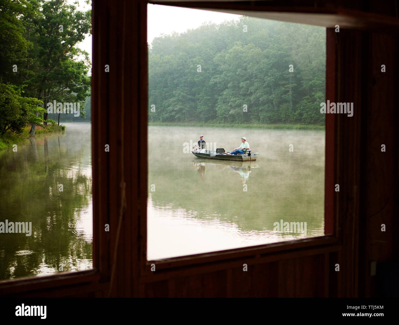 Old men fishing on lake hi-res stock photography and images - Alamy