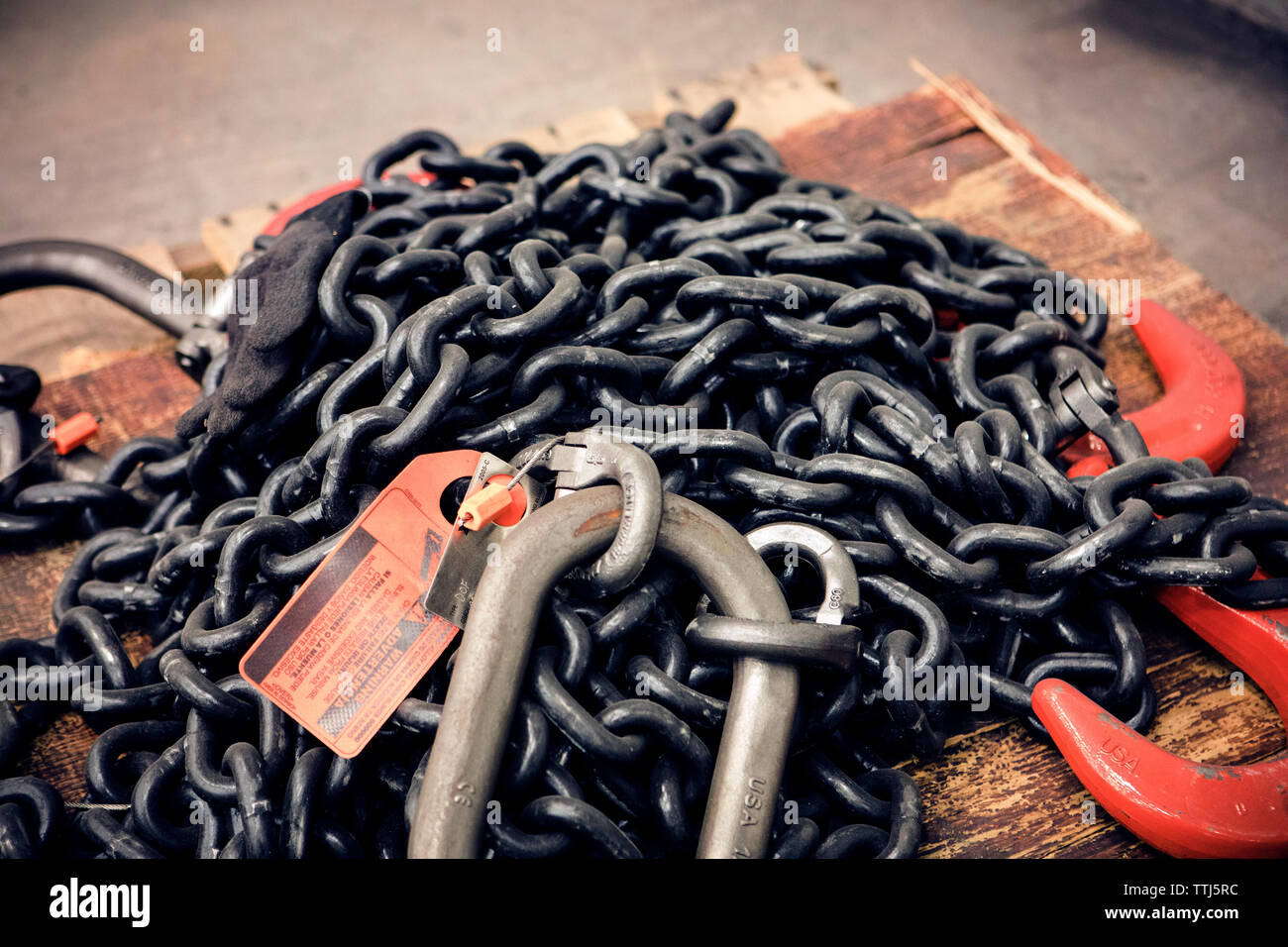 Close-up of chain and hooks at metal industry Stock Photo - Alamy