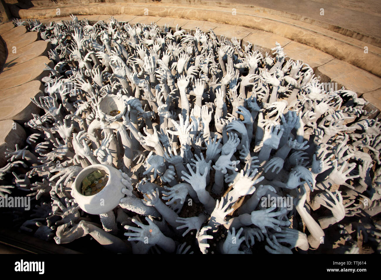 Sculpture of hands reaching money Stock Photo - Alamy