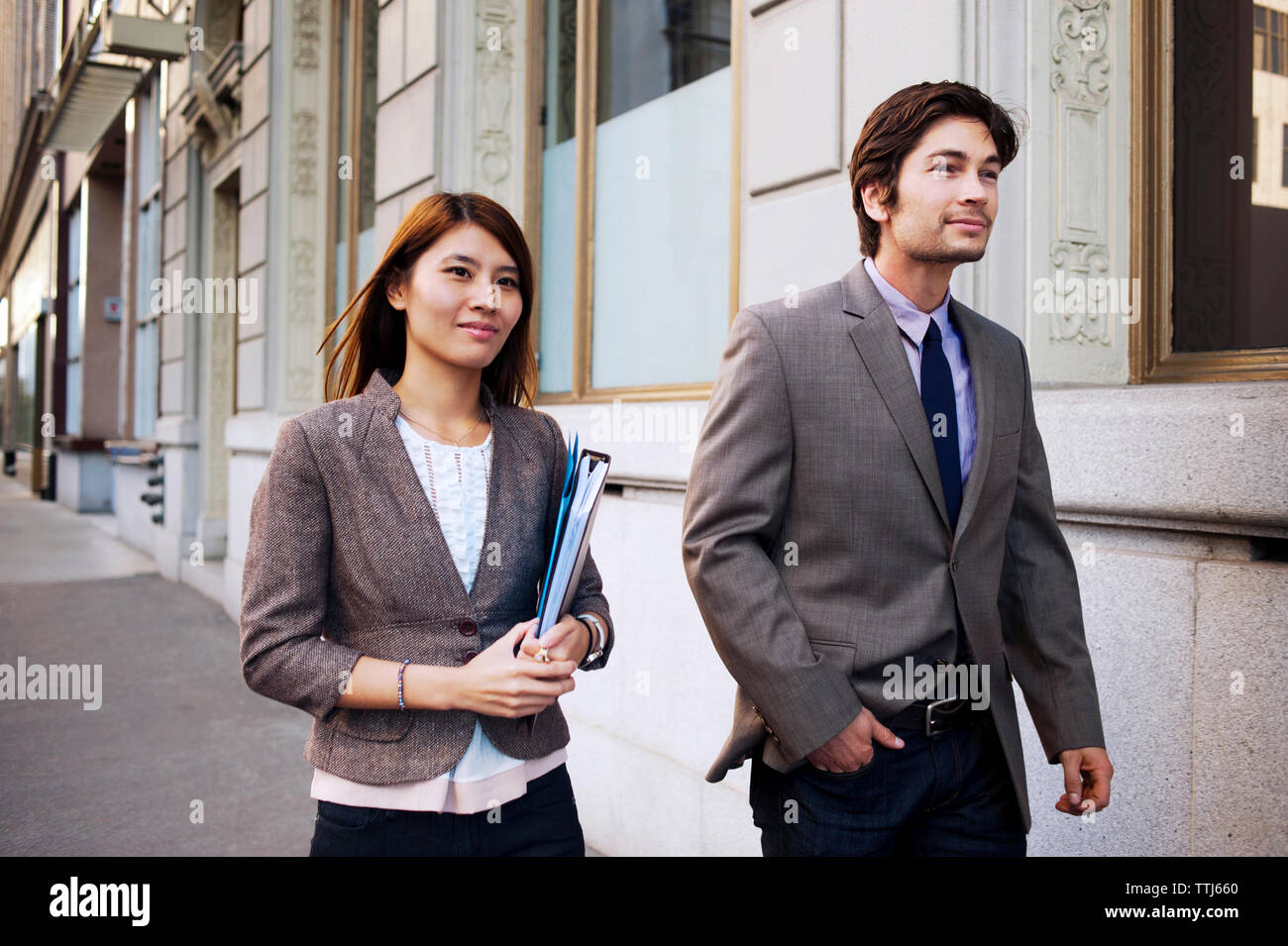 business people walking on footpath Stock Photo - Alamy