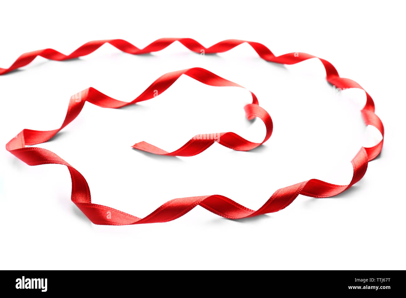 Red ribbon on light background Stock Photo - Alamy