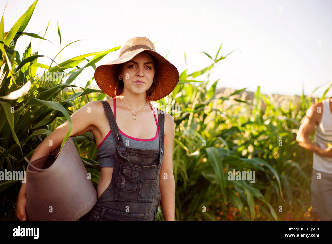 Farm woman overalls carrying basket hi-res stock photography and images ...
