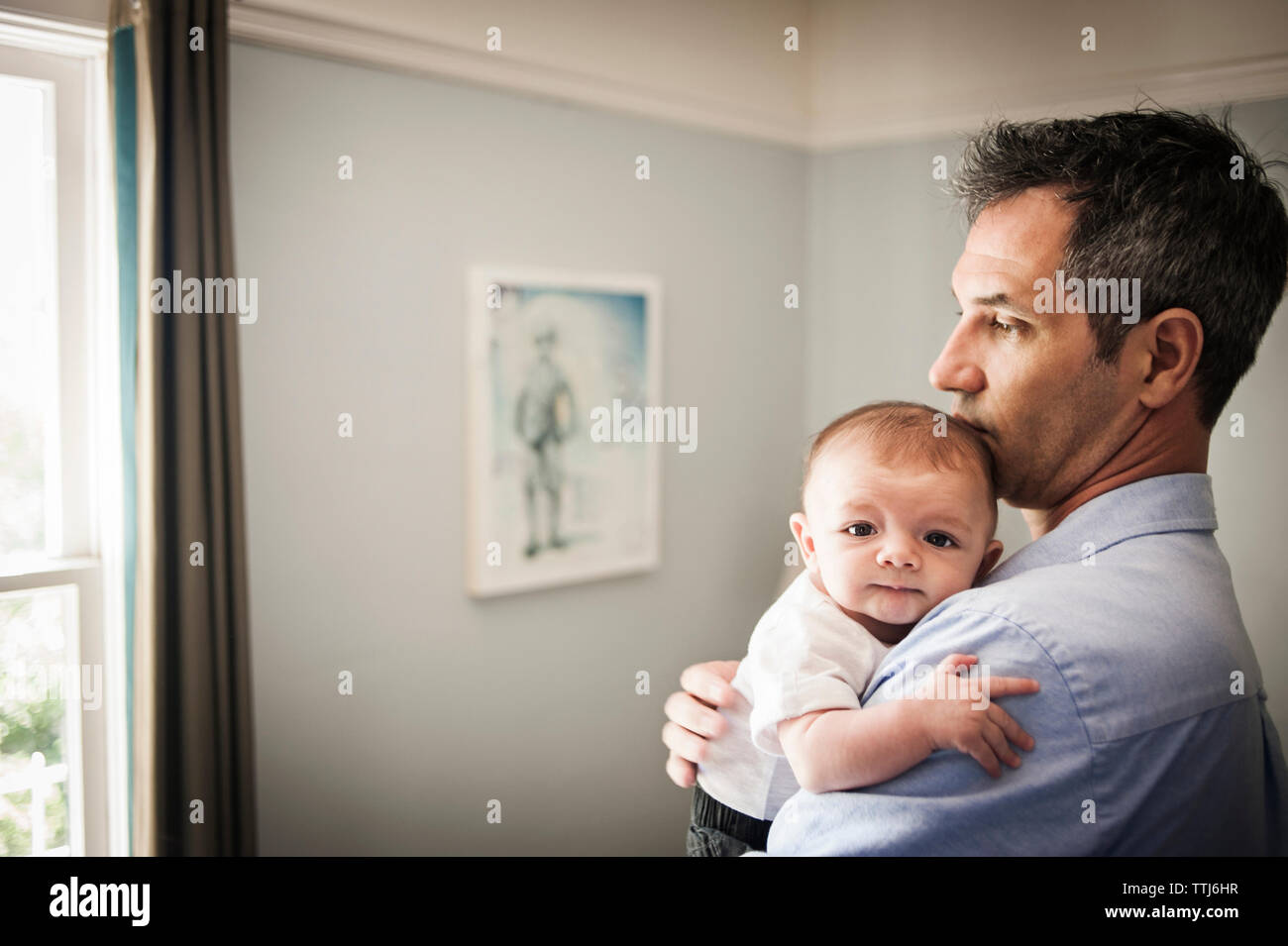 Man carrying boy hi-res stock photography and images - Alamy