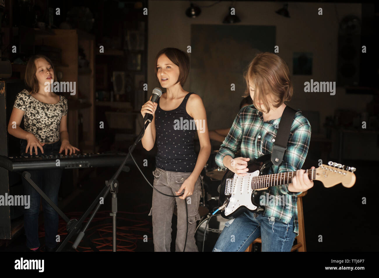 Girls practicing in recording studio Stock Photo - Alamy