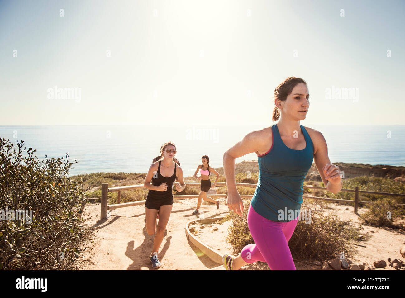 Three friends jogging together hi-res stock photography and images - Alamy