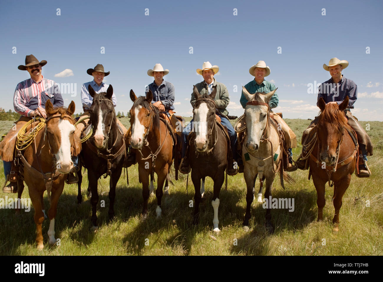 Cowboys on horses hi-res stock photography and images - Alamy