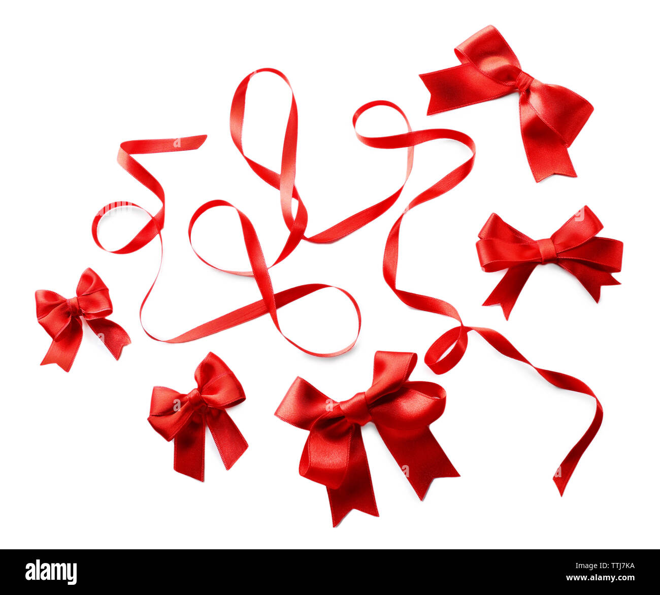 Red ribbon and bows on a white background Stock Photo - Alamy