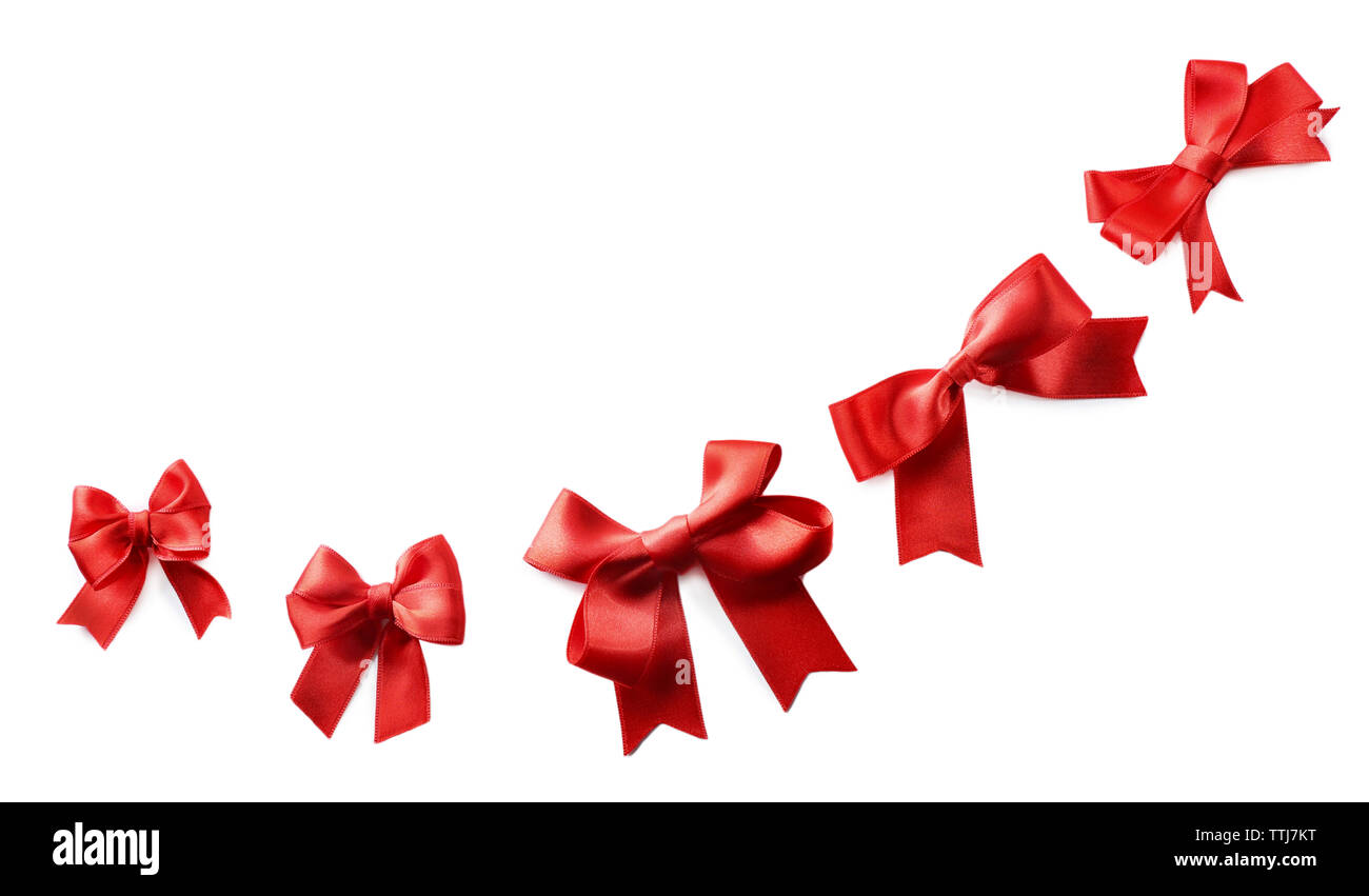 Red ribbon bows on a white background Stock Photo - Alamy