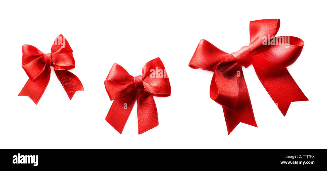 Red ribbon bows on a white background Stock Photo - Alamy
