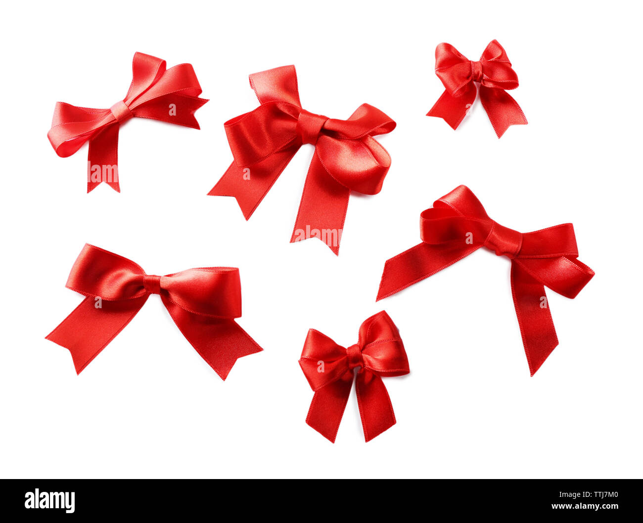 Red ribbon bows on a white background Stock Photo - Alamy