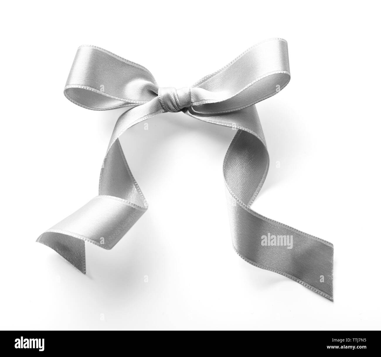 Grey ribbon bow on a white background Stock Photo - Alamy