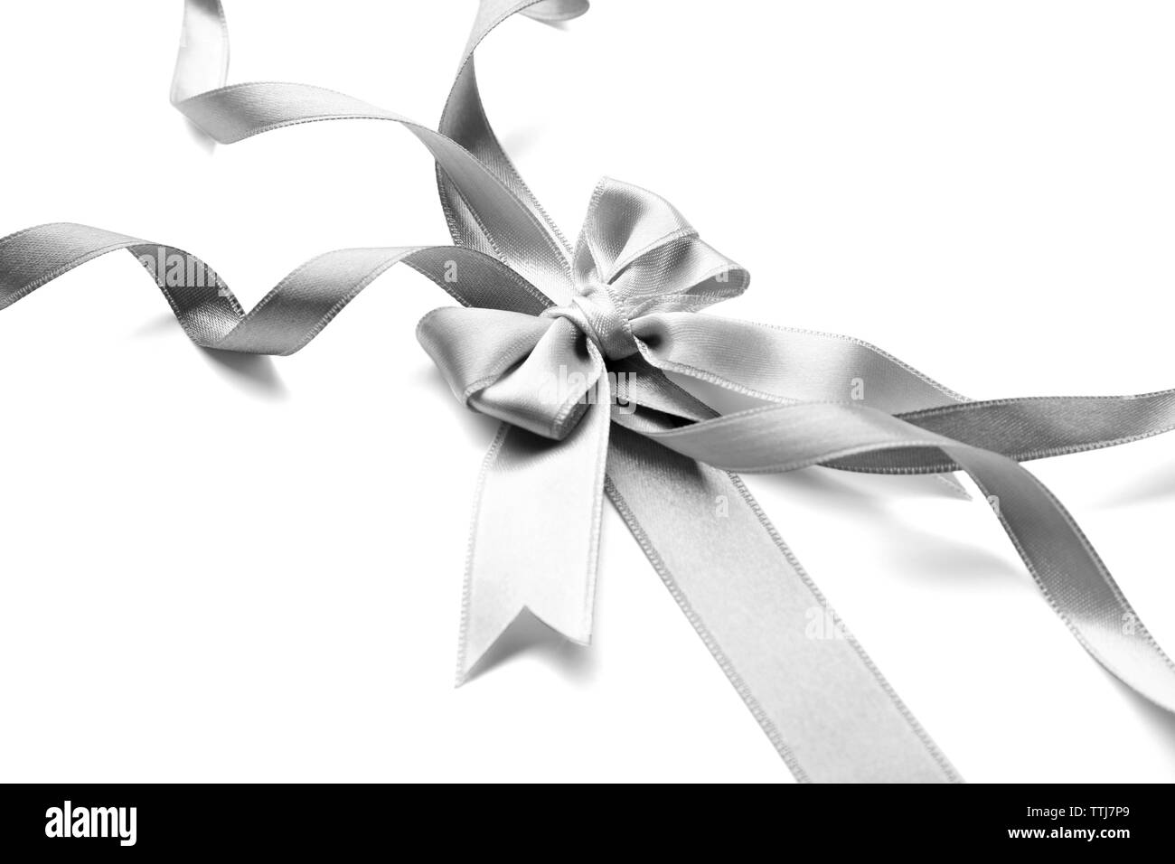 Grey ribbon bow on a white background Stock Photo - Alamy