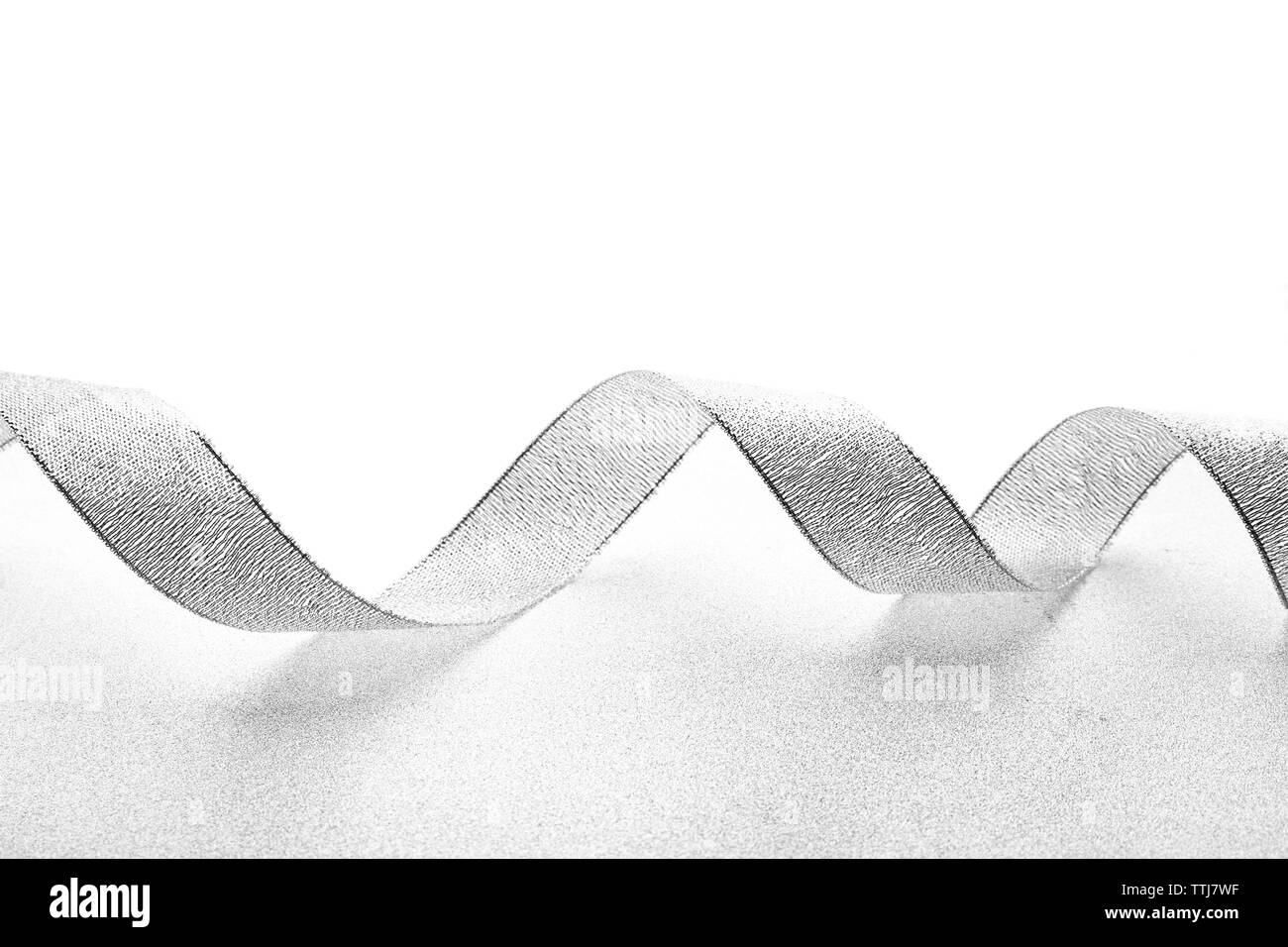 Grey ribbon on light textured background Stock Photo - Alamy