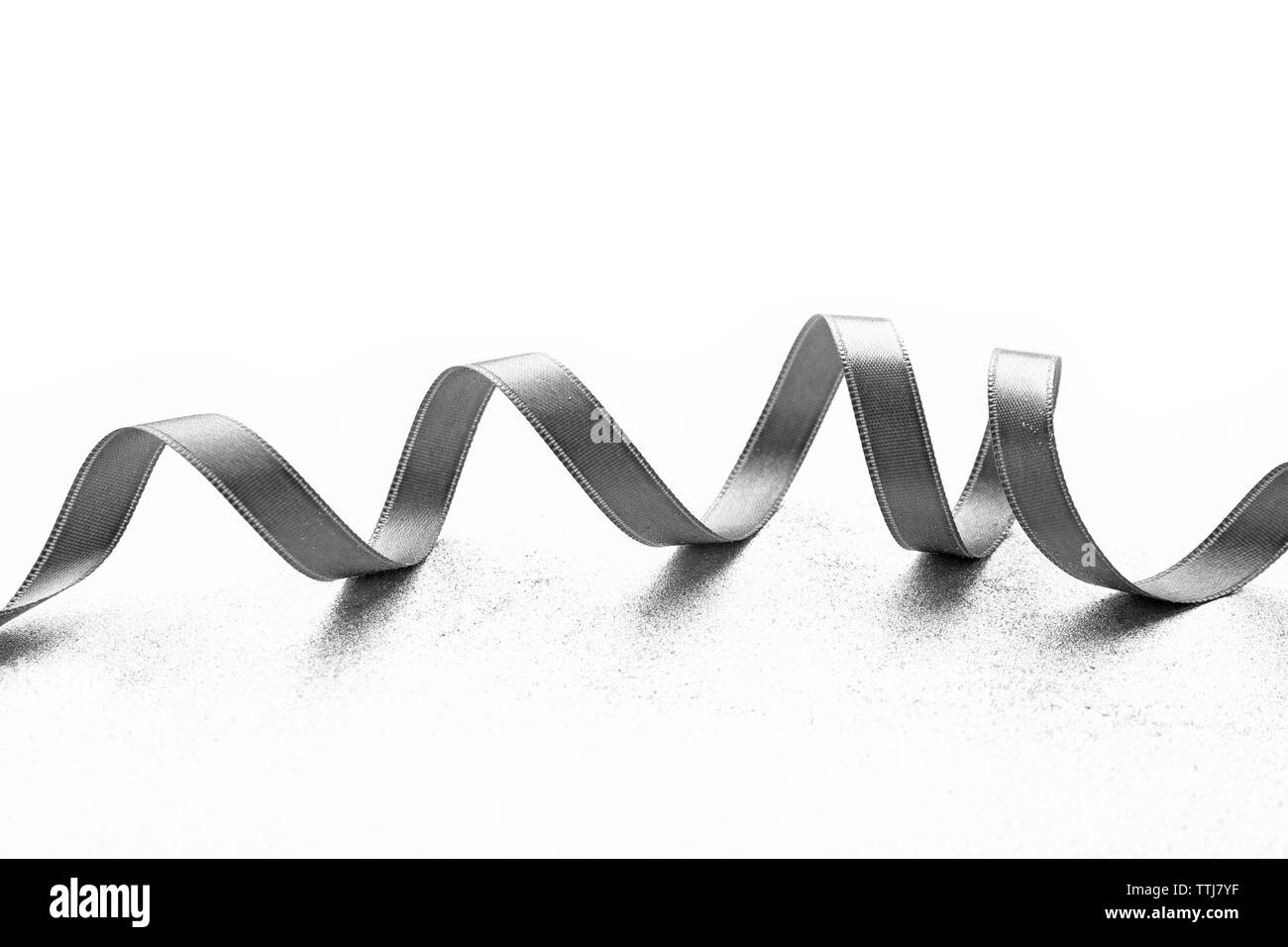 Grey ribbon on light textured background Stock Photo - Alamy