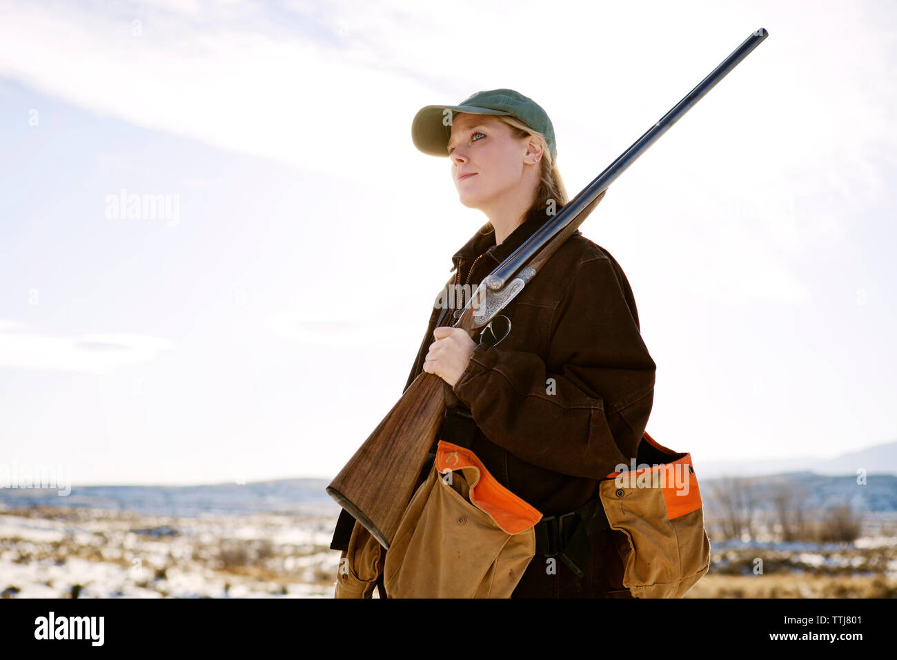 Female woman holding shotgun hi-res stock photography and images - Alamy