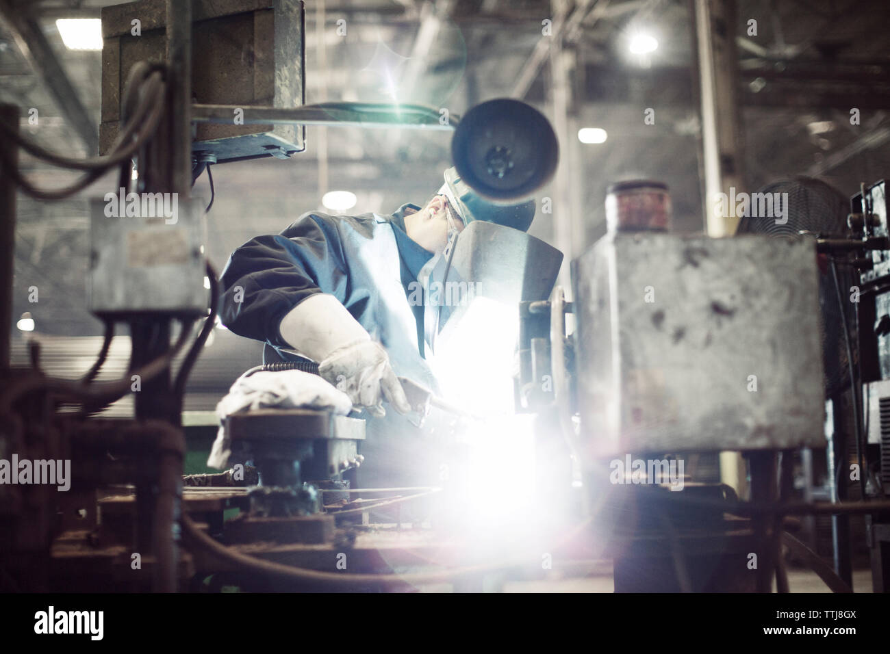 worker welding in factory Stock Photo - Alamy